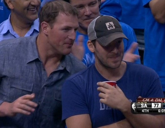 Tony Romo enjoys a fat dip at the Mavericks game