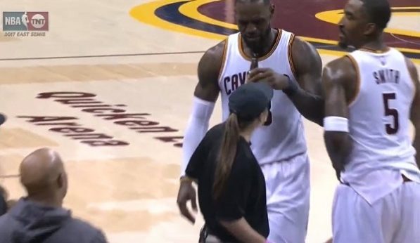 LeBron James grabs beer bottle during game