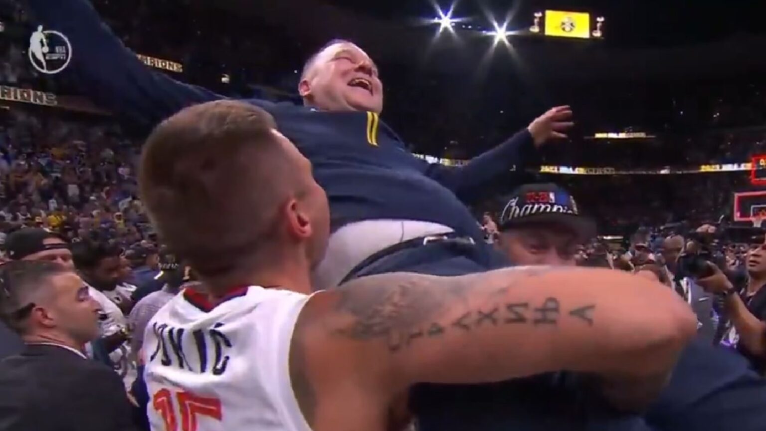 Video: Michael Malone hilariously gets lifted up by Jokic brothers in ...