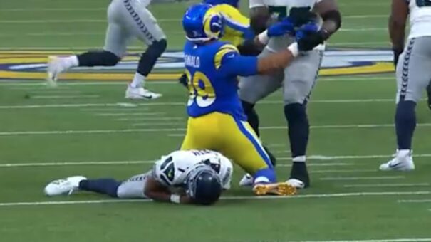 Geno Smith suffers elbow injury on big hit from Aaron Donald